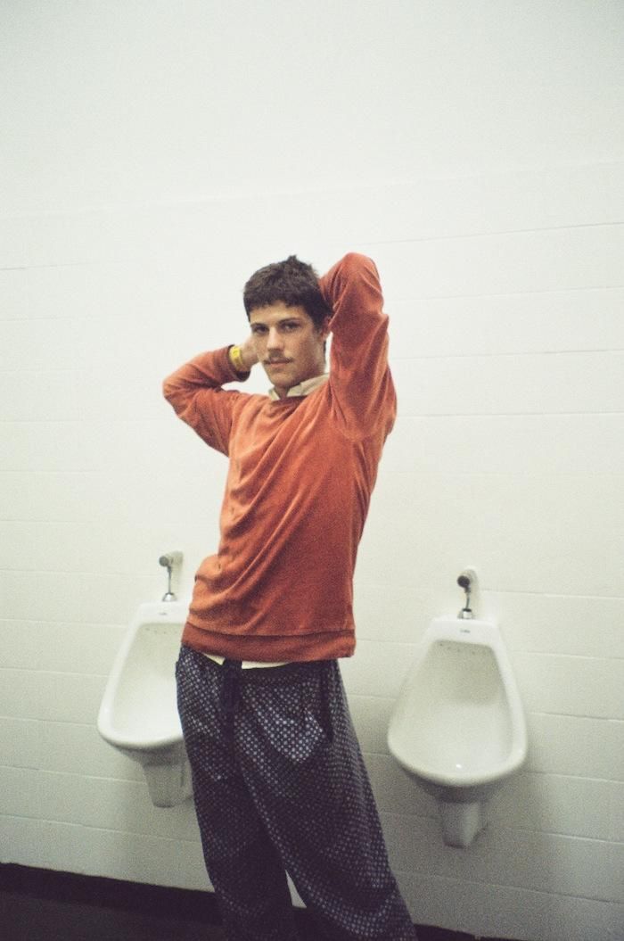 Male Models Pose By Toilets at Sao Paolo Fashion Week