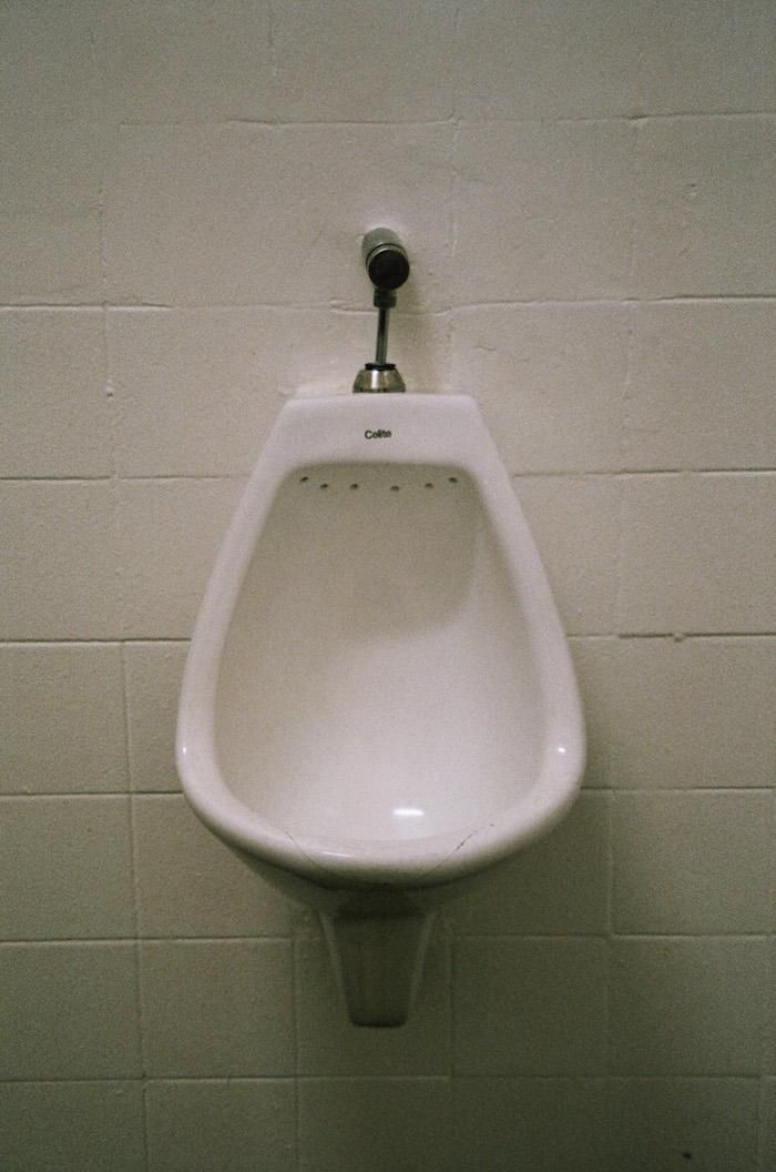 Male Models Pose By Toilets at Sao Paolo Fashion Week